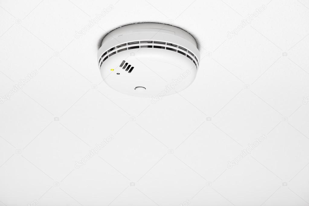 Smoke detector of fire alarm, white background Stock Photo by ©nikkytok ...