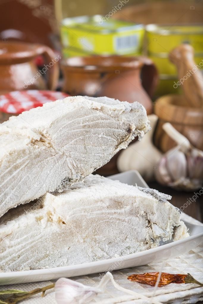 Salted cod cut on the table of the kitchen — Stock Photo © angelsimon ...