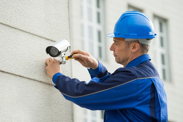 Technician Installing Camera - Stock Image - Everypixel