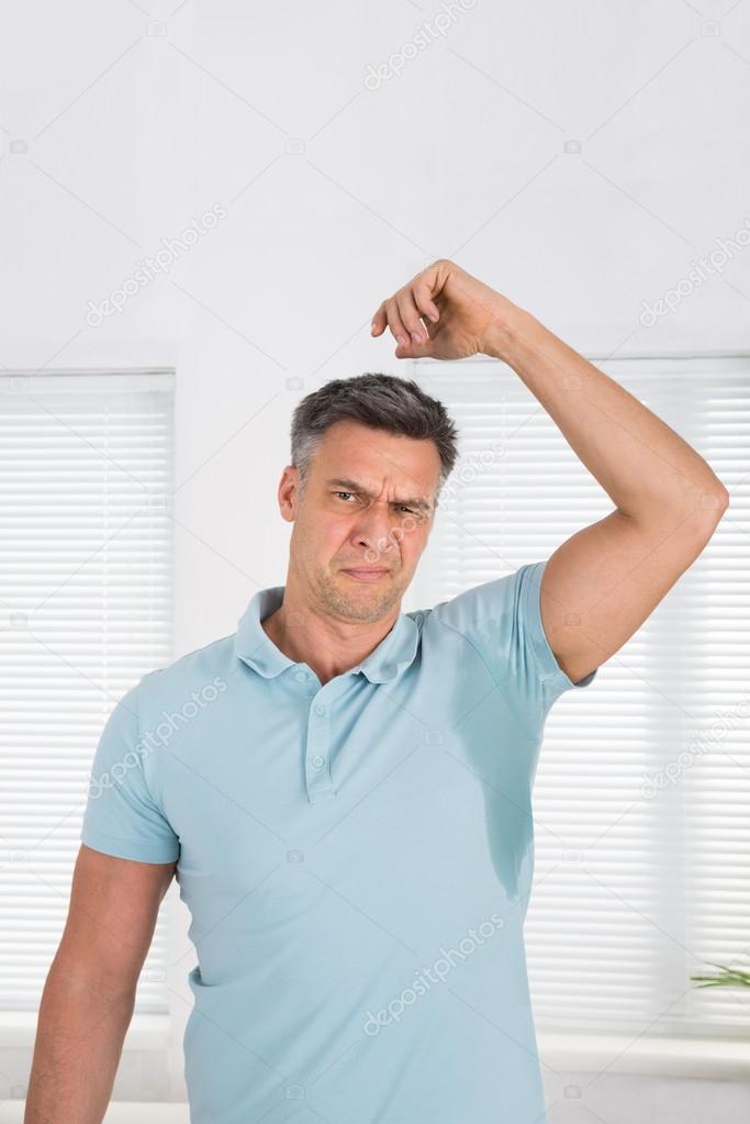 Man Sweating Very Badly — Stock Photo © AndreyPopov #104932440