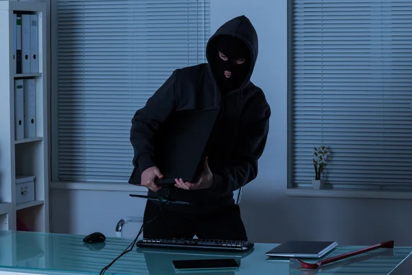 Thief Stealing Computer Stock Photo by ©AndreyPopov 104931662