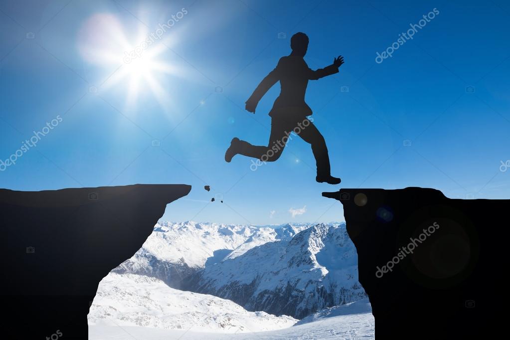 Man Jumping Over Mountains Stock Photo by ©AndreyPopov 110428916