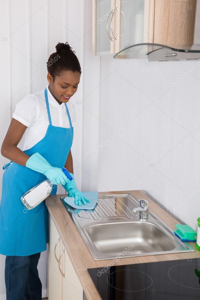 Female Janitor Cleaning Sink Stock Photo by ©AndreyPopov 110429708