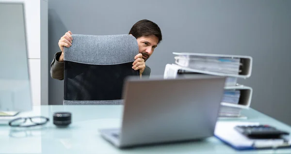 Hiding Under Desk Office Worker