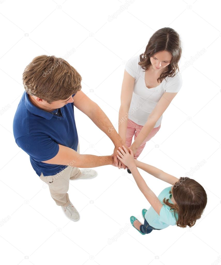Family Stacking Hands Stock Photo by ©AndreyPopov 52163987