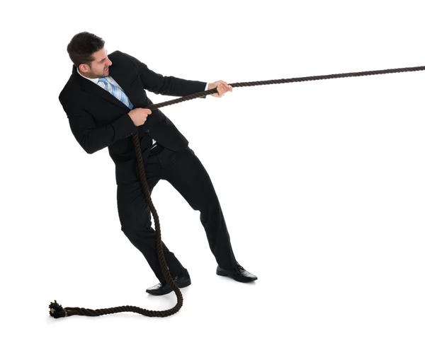 Man pulling a rope Stock Photo by ©odua 16978509