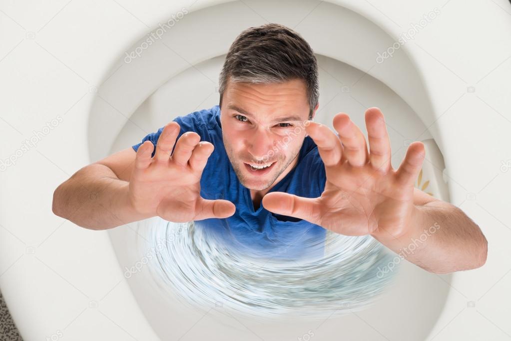 Hombre dentro del inodoro — Foto de stock #63946815 © AndreyPopov