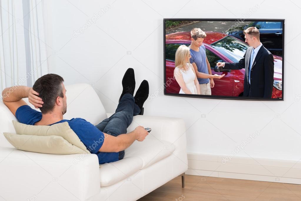 Man Watching Television — Stock Photo © AndreyPopov #64648419