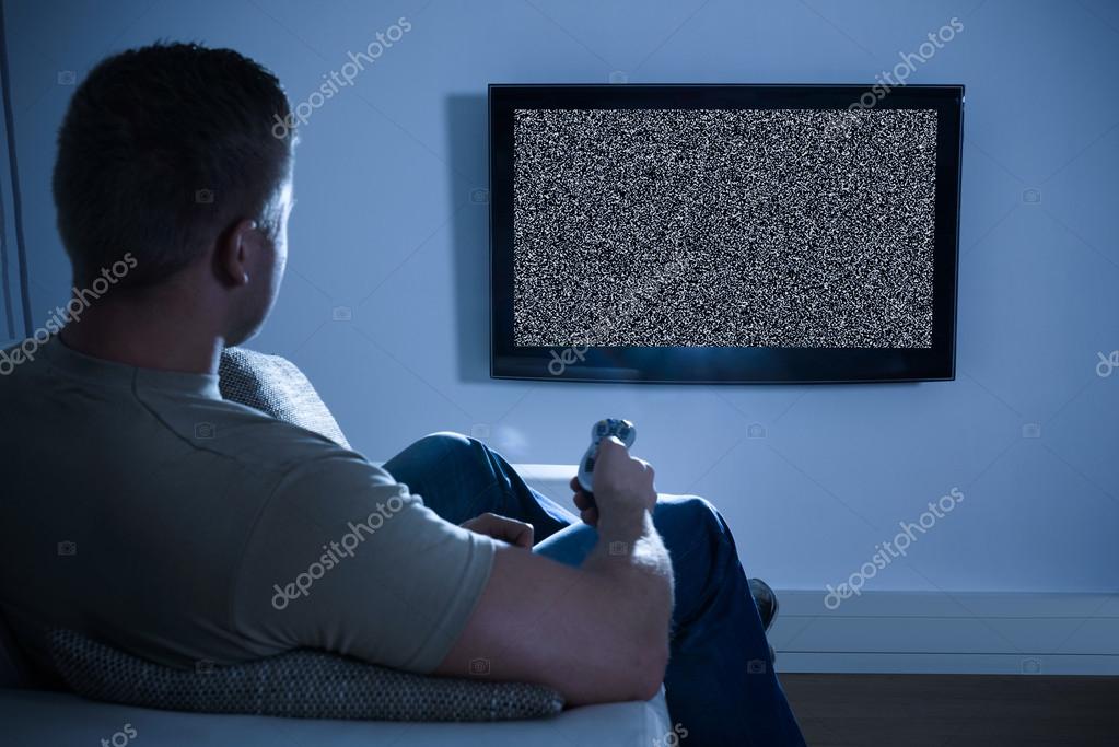 Man In Front Of Television — Stock Photo © AndreyPopov #72096779