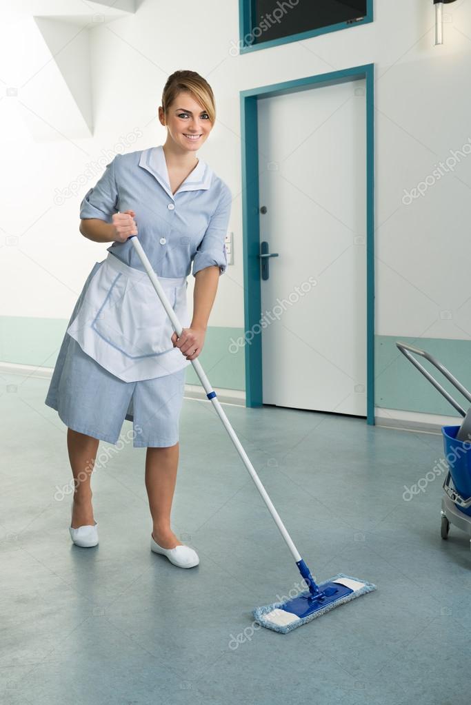Female Janitor Cleaning Floor Stock Photo by ©AndreyPopov 72097325