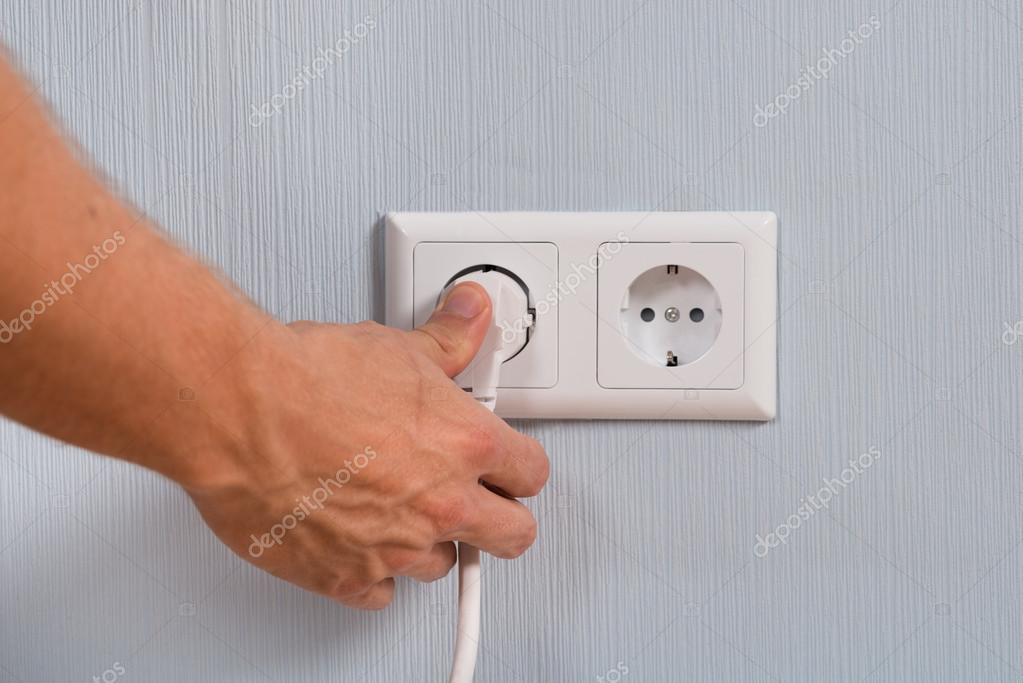 Hand Inserting Electrical Plug — Stock Photo © AndreyPopov #74747285 Hand Inserting Electrical Plug — Stock Photo © AndreyPopov #74747285
