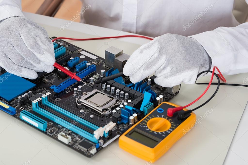 Hands Checking Motherboard Stock Photo by ©AndreyPopov 77886646