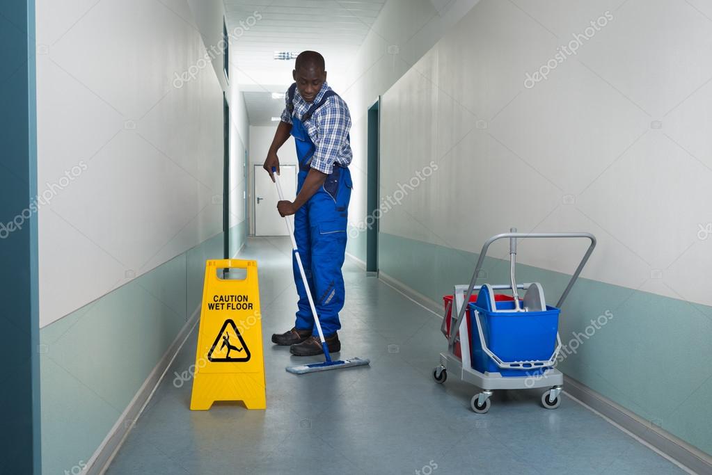 Male Janitor Mopping — Stock Photo © AndreyPopov #77887272