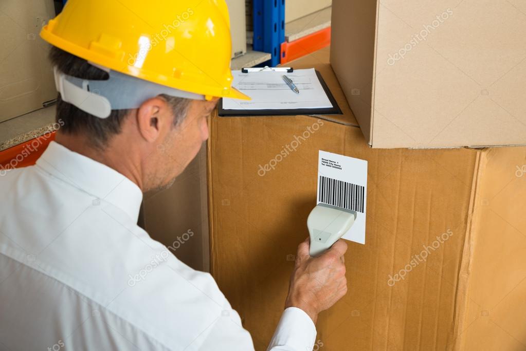 Manager Scanning Cardboard Box Stock Photo by ©AndreyPopov 77903776