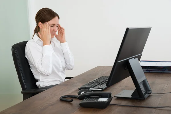 Businesswoman Having Head Pain In Office - Stock Image - Everypixel