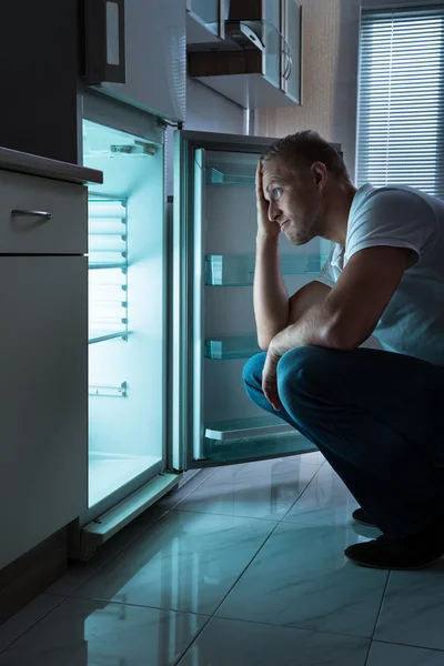 Man Looking For Food In Fridge - Stock Image - Everypixel
