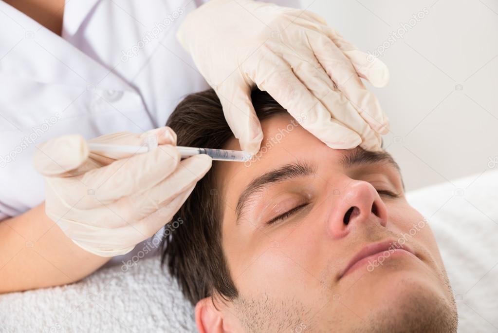 Man Having Botox Treatment Stock Photo by ©AndreyPopov 80939928