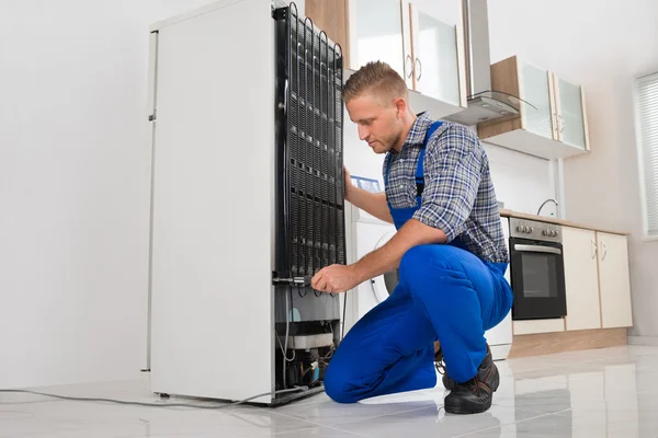 Worker Repairing Refrigerator - Stock Image - Everypixel