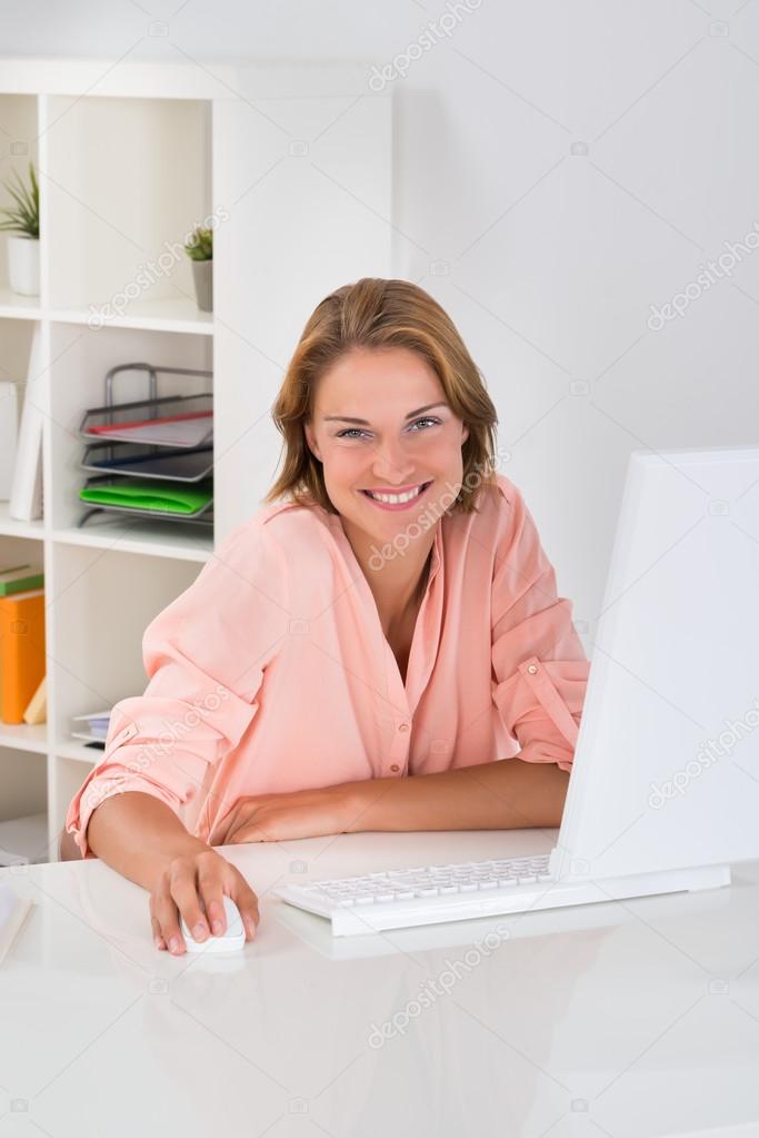 Woman Working On Desktop Computer Stock Photo by ©AndreyPopov 86111804