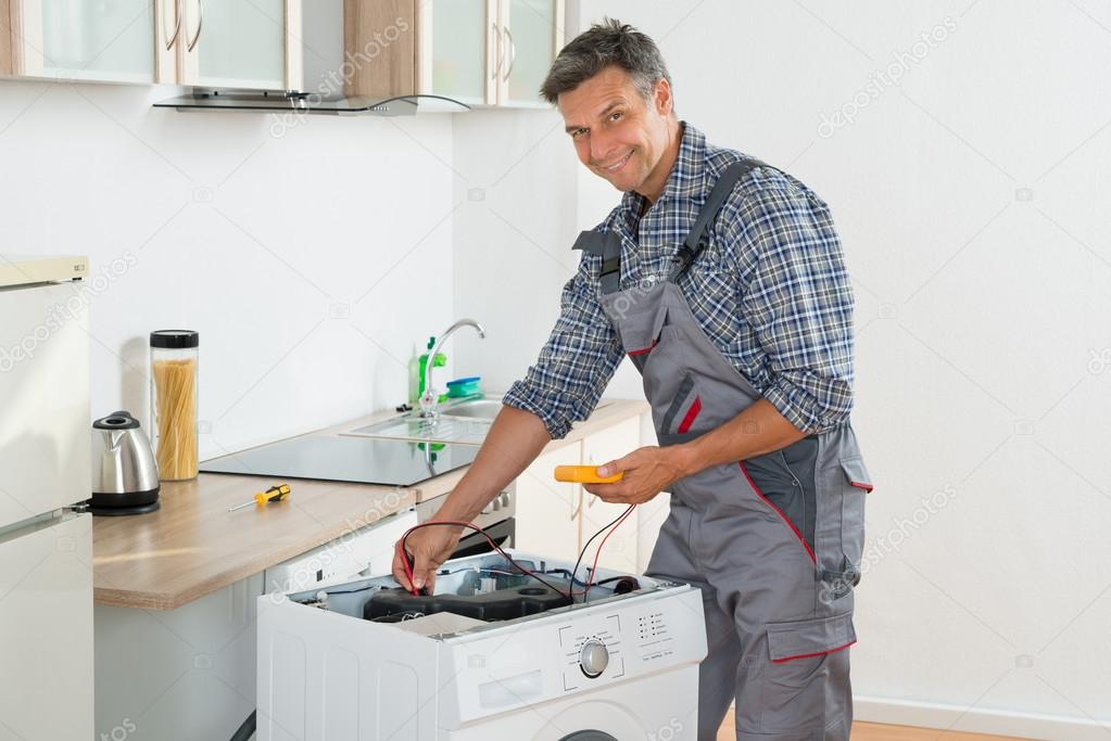 Technician Checking Washing Machine — Stock Photo © AndreyPopov #90238838