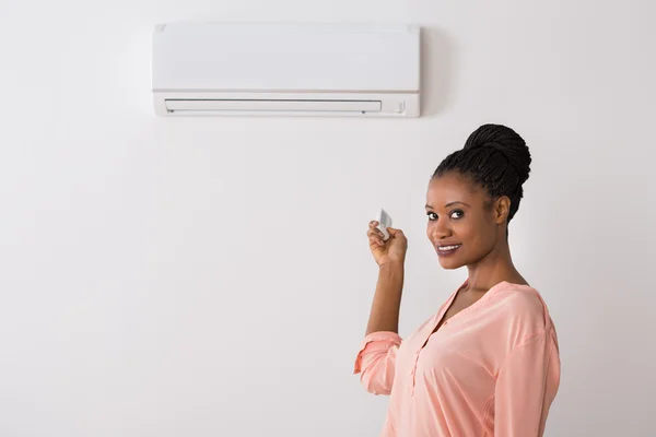Woman air conditioner Stock Photos, Royalty Free Woman air conditioner ...