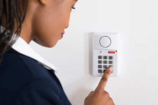 Person Using Security Alarm Control — Stock Photo © AndreyPopov #62697527