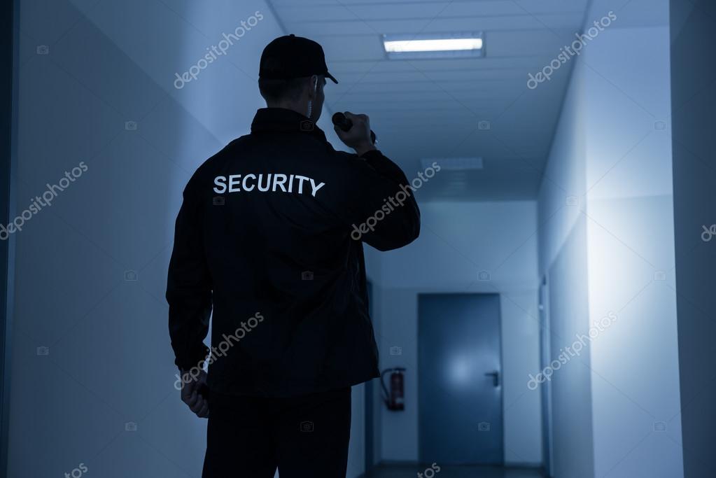 Security Guard With Flashlight — Stock Photo © AndreyPopov #97935046
