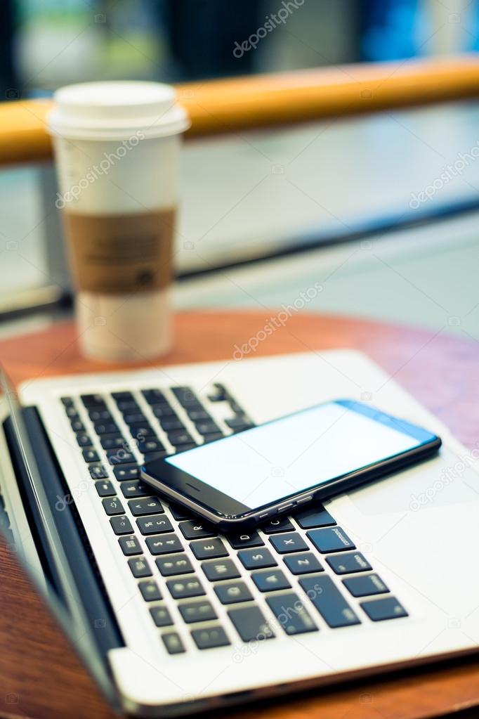 Cup of coffee, cellphone and laptop computer Stock Photo by ...