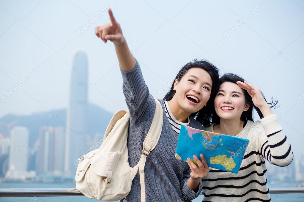 Women tourists looking for destination on map ⬇ Stock Photo, Image by ...