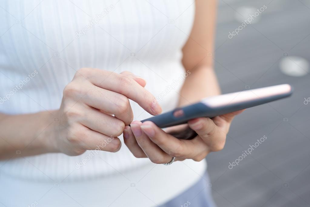 Woman finger touch on mobile phone — Stock Photo © leungchopan #110057270