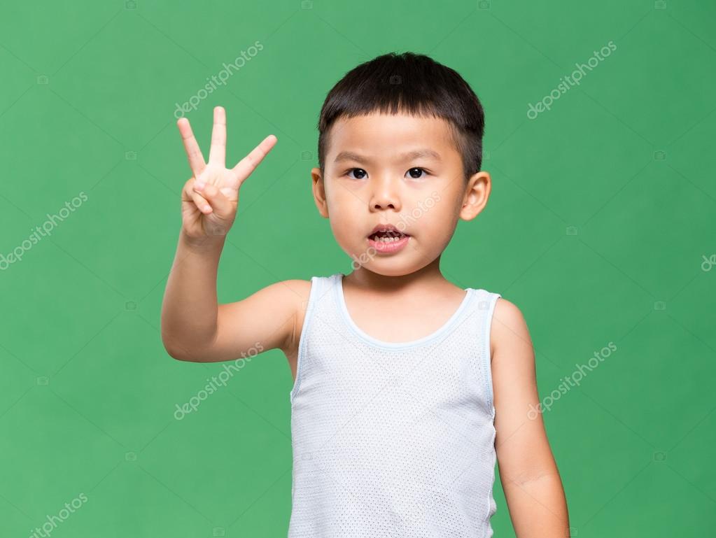 Little boy showing three fingers Stock Photo by ©leungchopan 121455464