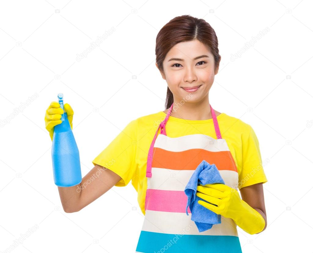 Housewife using spray and towel — Stock Photo © leungchopan #54943489