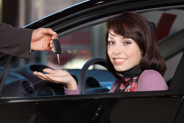 Woman receiving the car keys - Stock Image - Everypixel