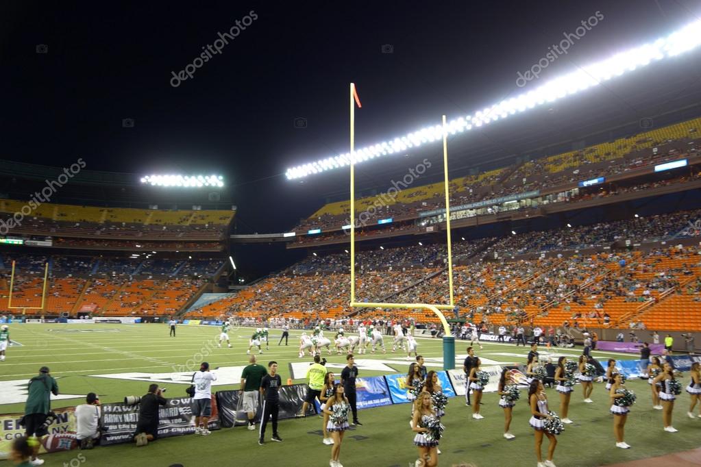 Players line up for play across the field near goal line of coll ...