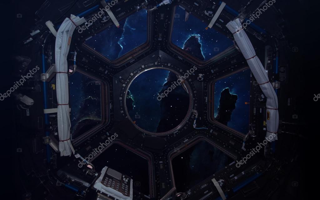 A round window on a space station. This image elements furnished by ...