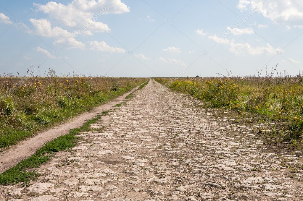 Old stone road Stock Photo by ©homiel 119423516
