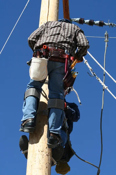 Electrical lineman working — Stock Photo © graphicphoto #61016069