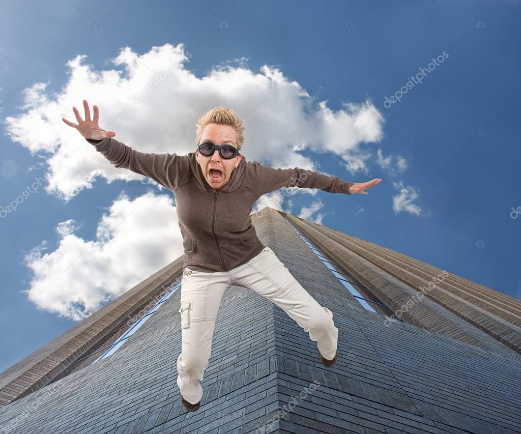 Woman falling from building Stock Photo by ©graphicphoto 53480383
