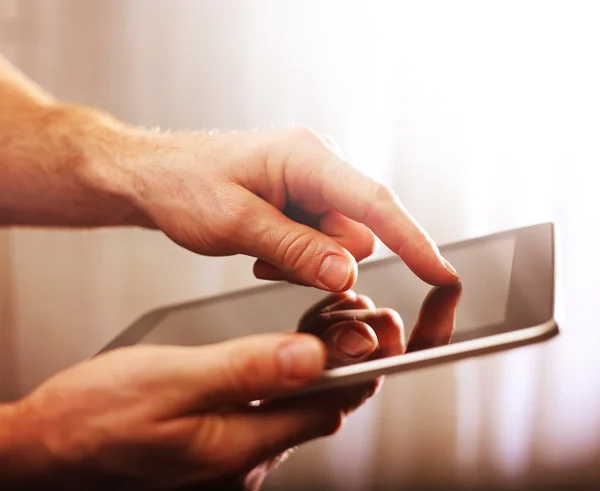 Hands typing on a tablet - Stock Image - Everypixel