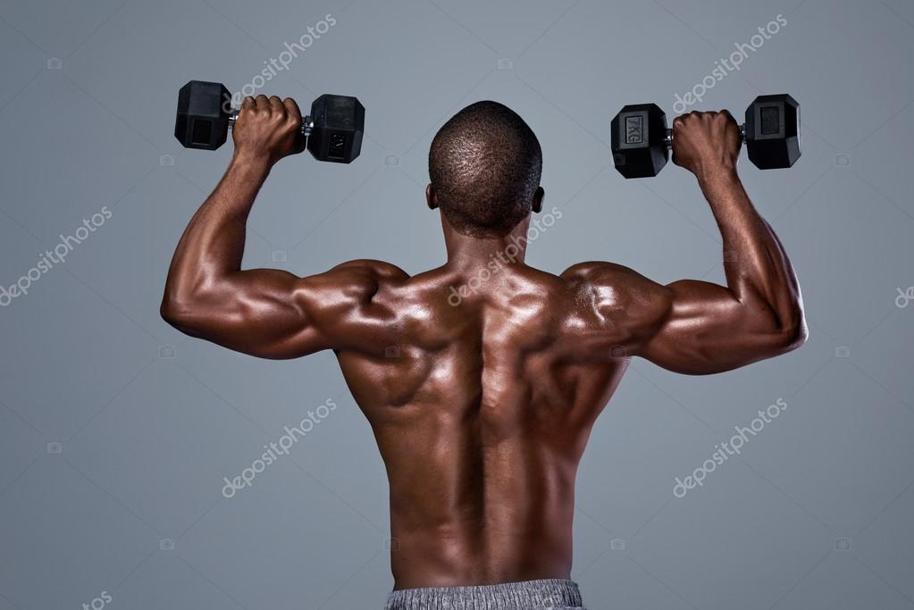 Man with strong muscles lifting weights Stock Photo by ©Daxiao ...