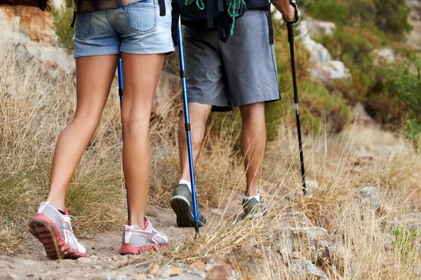 couple's legs walking along hiking path - Stock Image - Everypixel