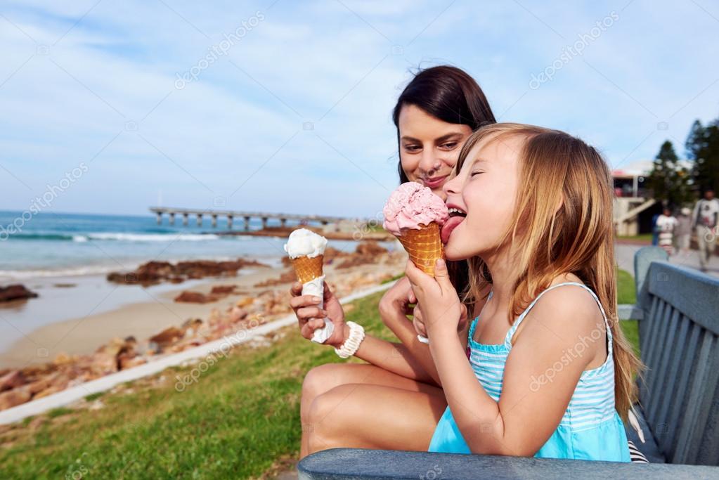 Mom and daughter enjoy ice cream at beach Stock Photo by ©Daxiao ...