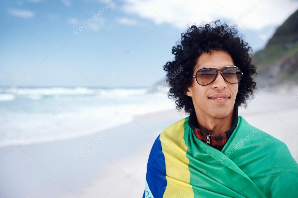 Brazilian man with Brasil flag Stock Photo by ©Daxiao_Productions 74993563
