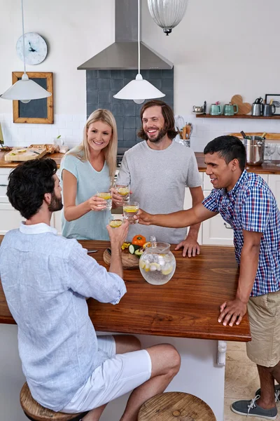 Friends toasting indoors at gathering - Stock Image - Everypixel