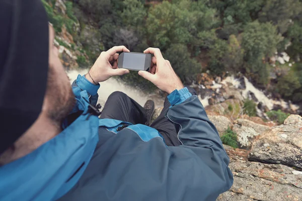 man with gps device or phone outdoors - Stock Image - Everypixel