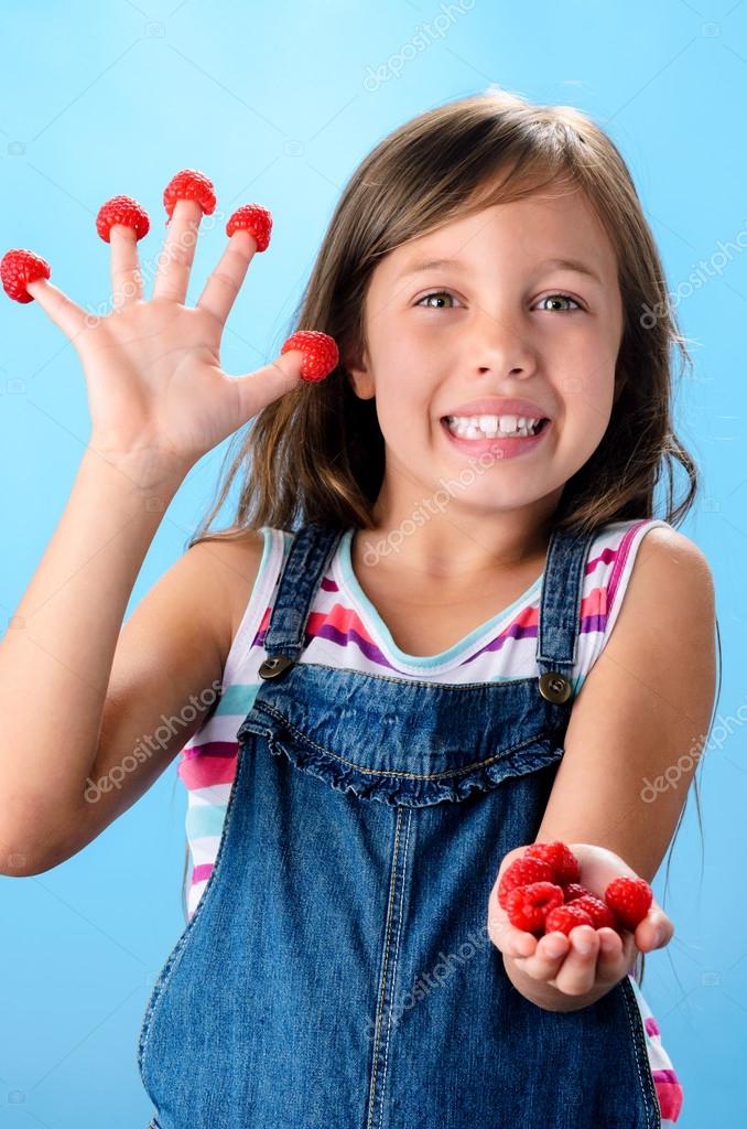 Happy young girl with raspberries — Stock Photo © Daxiao_Productions ...
