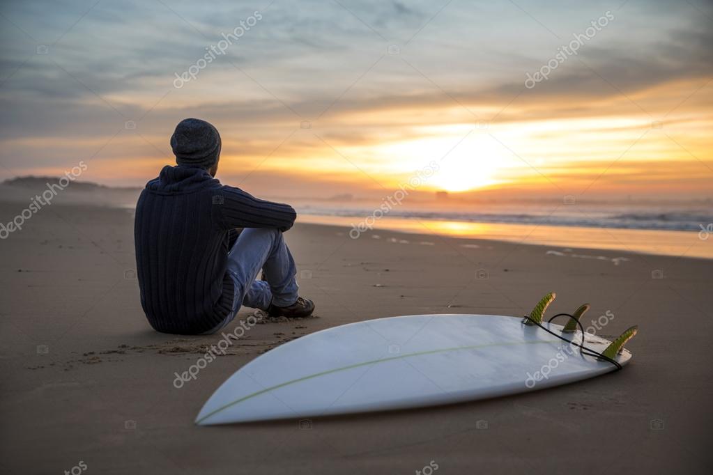 Surfer at the sunset looking to the waves. Stock Photo by ©ikostudio ...