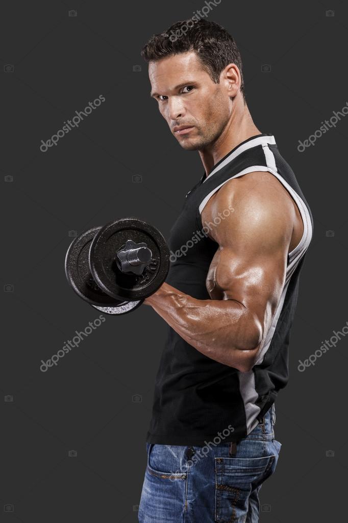 Muscle man lifting weights Stock Photo by ©ikostudio 68908369