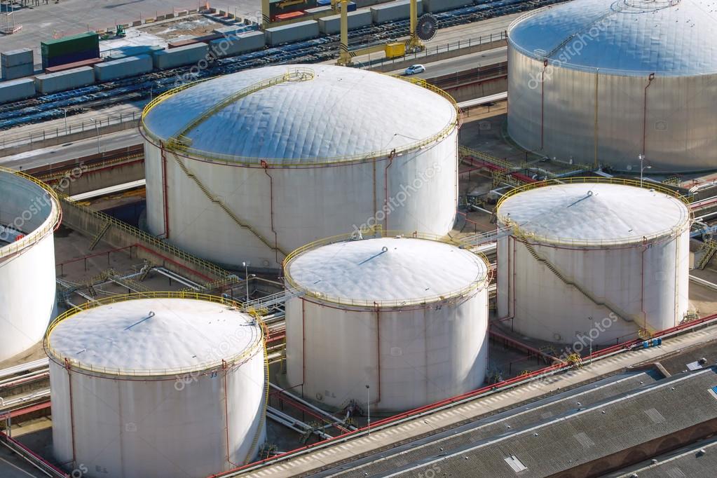 White gas storage tanks — Stock Photo © elxeneize #64430189