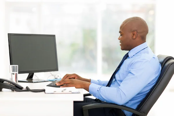 Black businessman typing - Stock Image - Everypixel